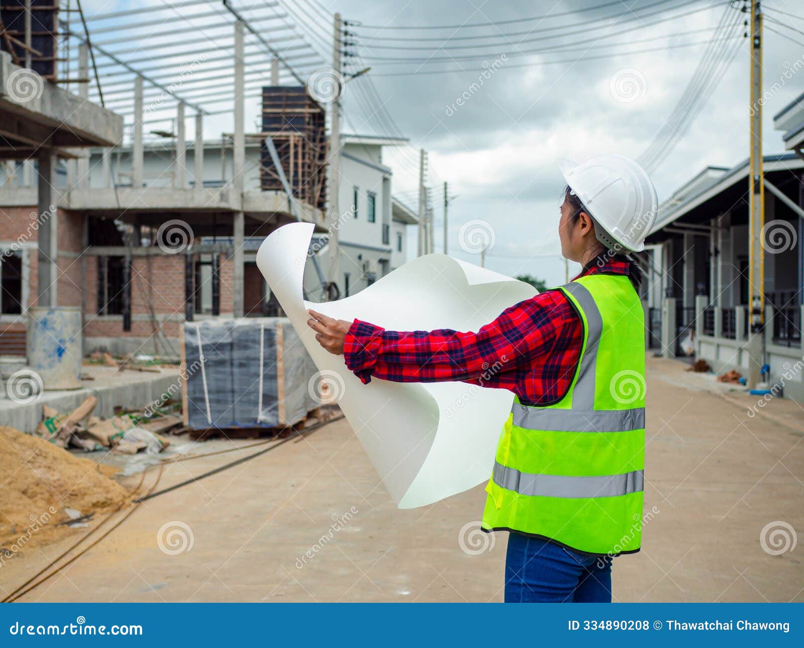 Engineers Holding Blueprint Project Working Outdoors Building Side with ...