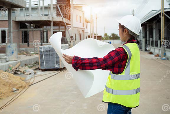 Engineers Holding Blueprint Project Working Outdoors Building Side with ...