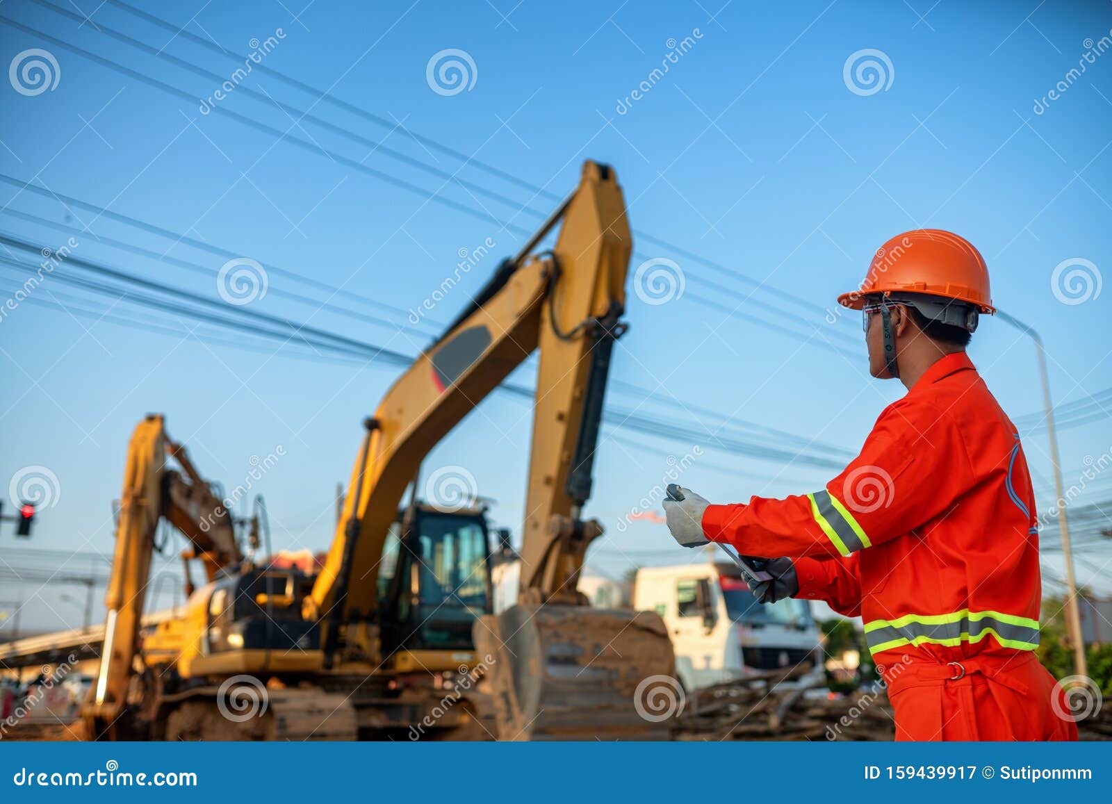 Engineers Inspect the Backhoe on the Construction Site Stock Image ...
