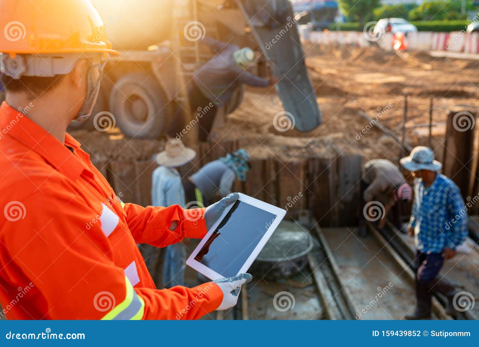 Engineers are Inspecting the Pouring of the Cement Floor with Tablets ...