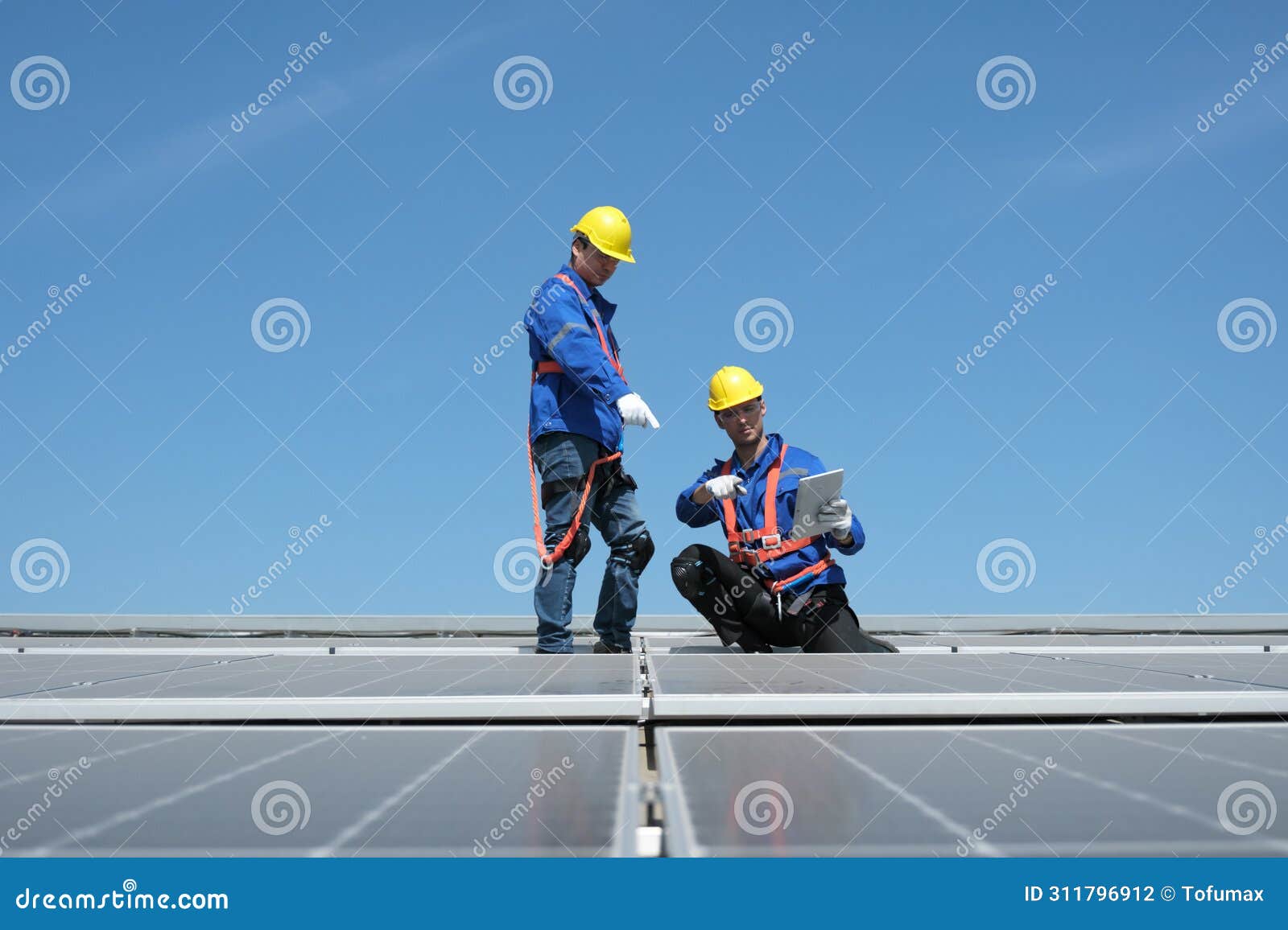 Engineers Install Solae Cell on the Roof of Factory Stock Photo - Image ...