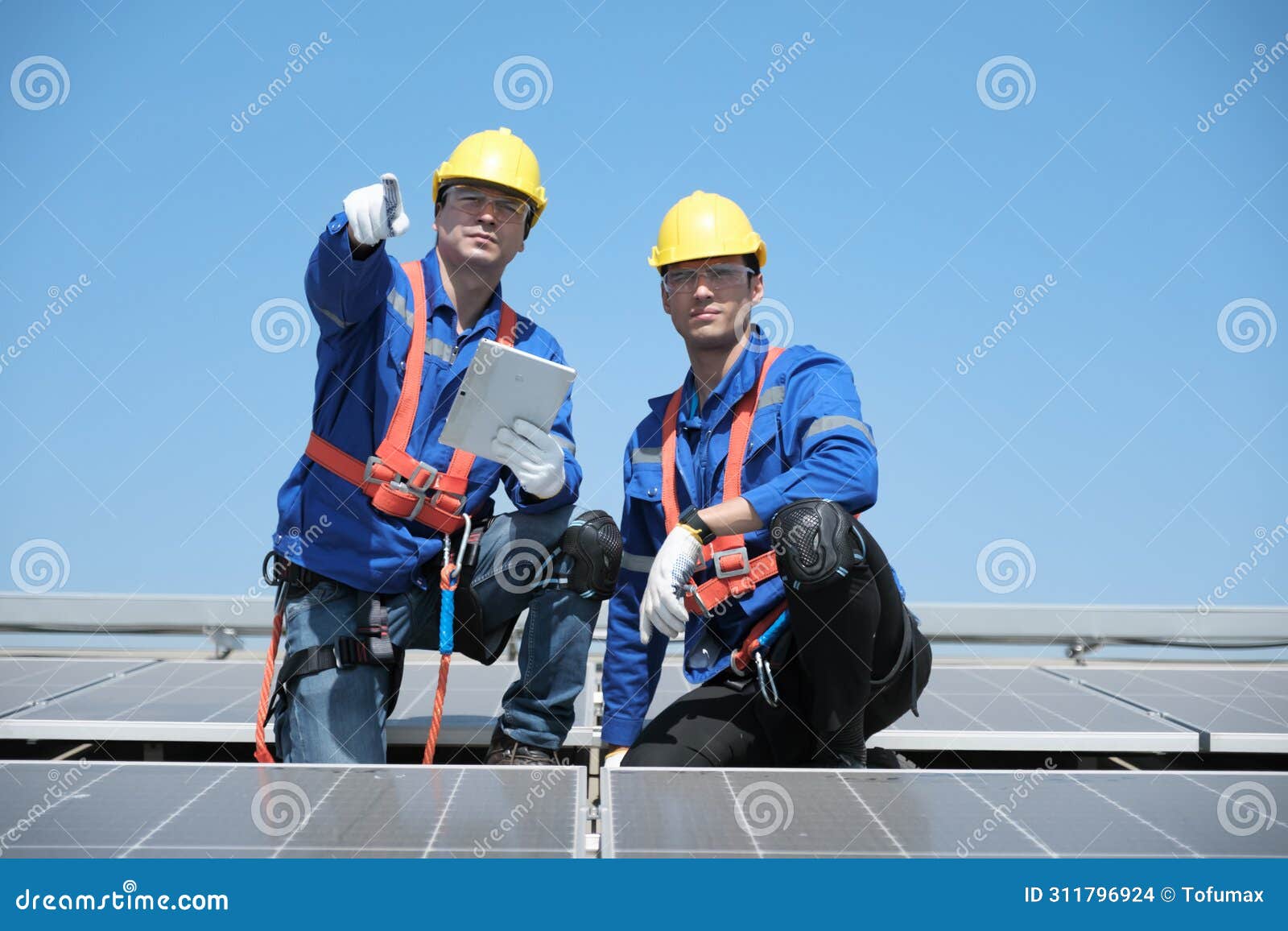 Engineers Install Solae Cell on the Roof of Factory Stock Photo - Image ...
