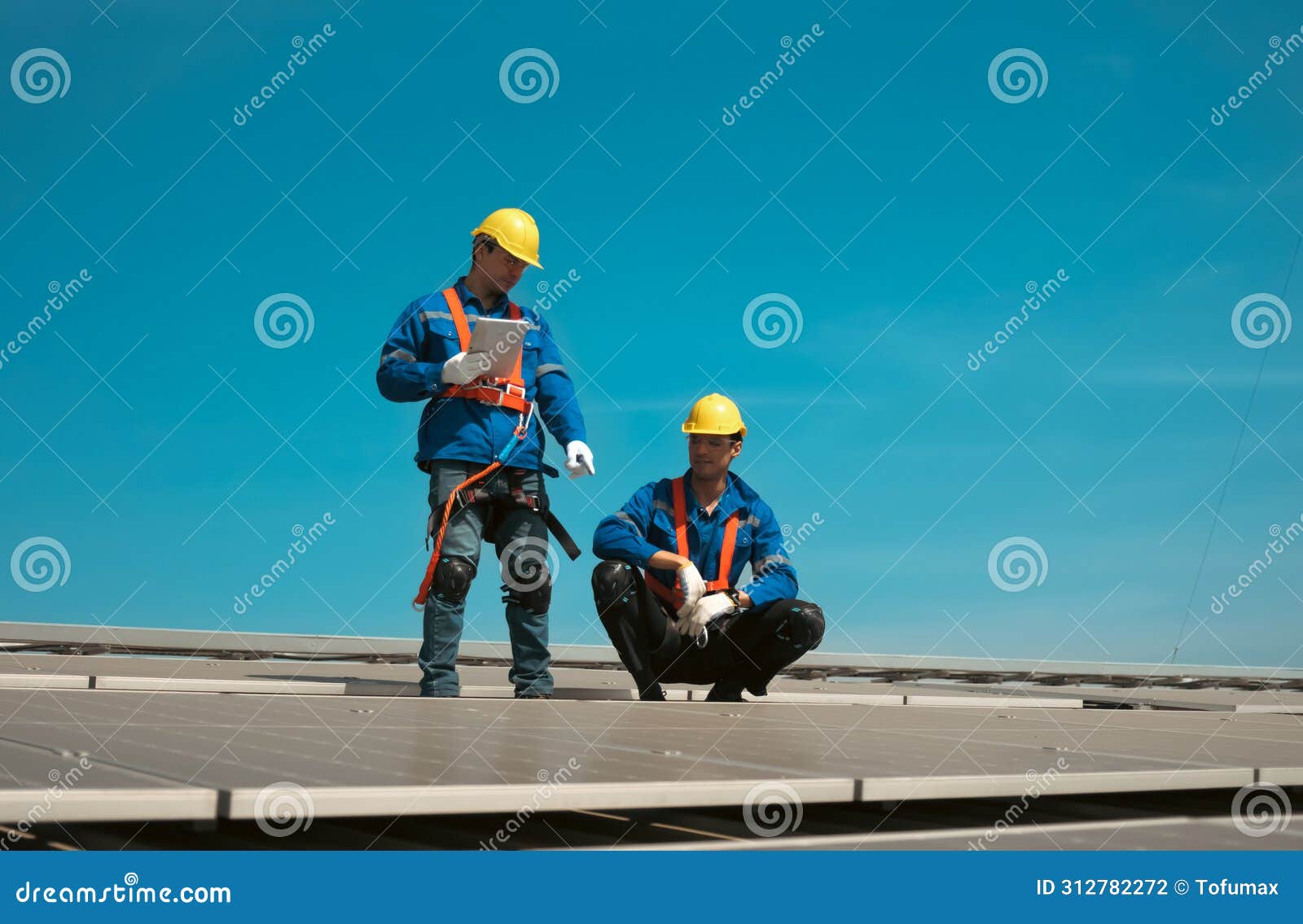 Engineers Install Solae Cell on the Roof of Factory Stock Photo - Image ...