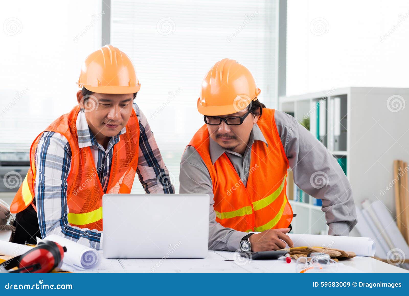 Engineers with laptop stock image. Image of vest, cooperation - 59583009