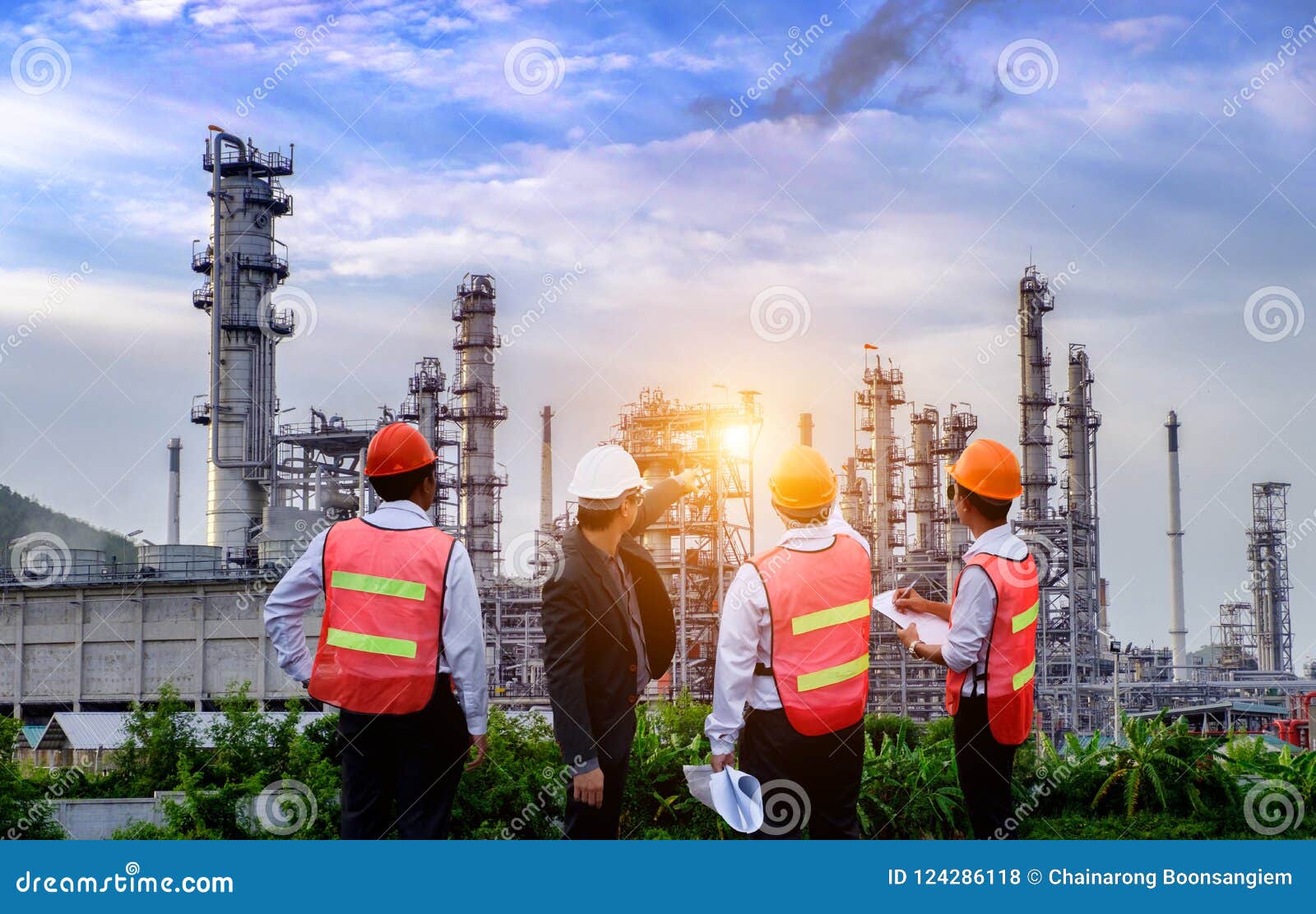 The Engineers are Standing on Large Industry Background. Stock Photo ...