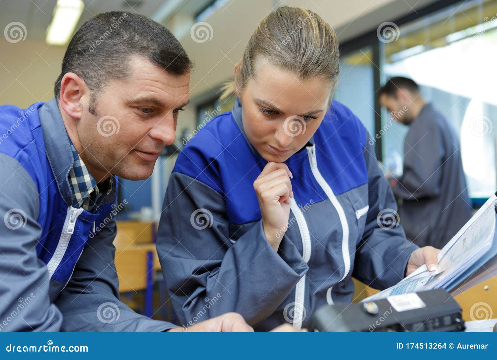 Engineers Looking at Machine Stock Photo - Image of teamwork, business ...