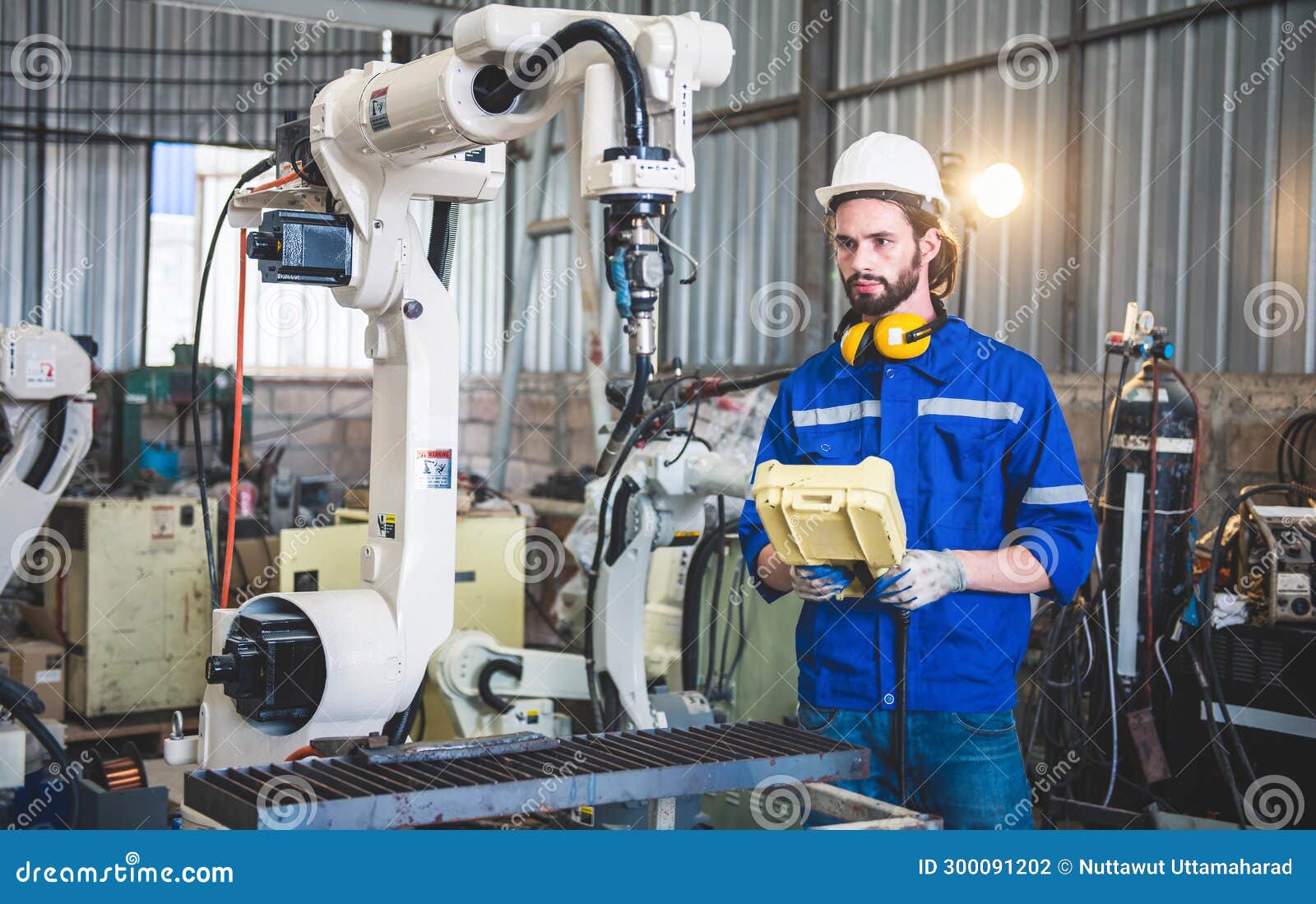 Engineers Mechanic Using Computer Controller Robotic Arm for Welding ...