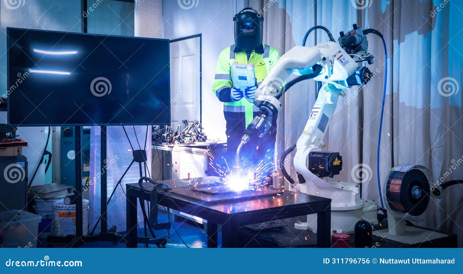 Engineers Mechanic Using Computer Controller Robotic Arm for Welding ...