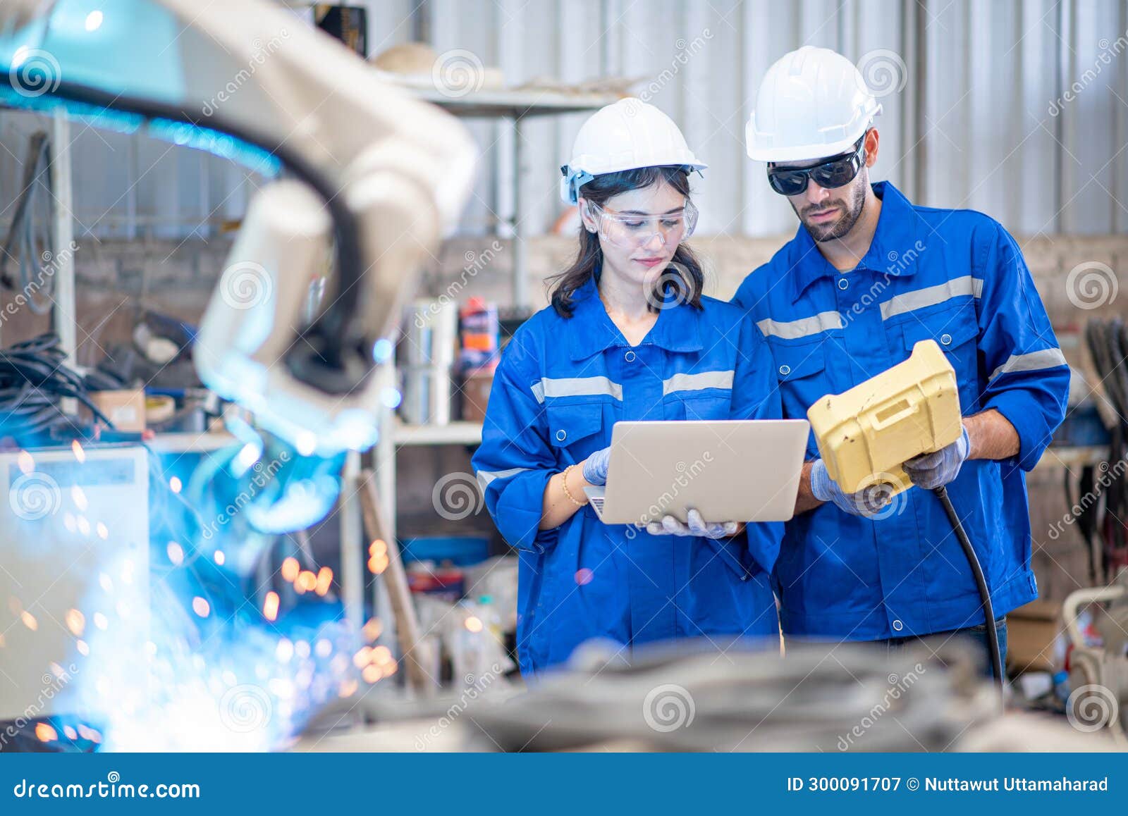 Engineers Mechanic Using Computer Controller Robotic Arm for Welding ...