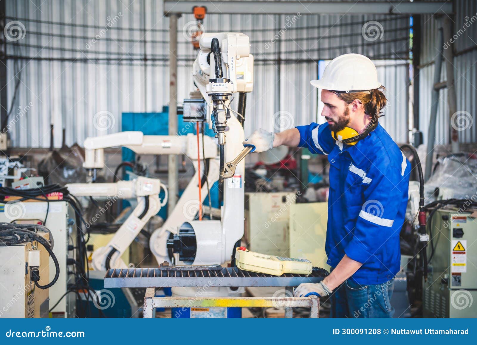 Engineers Mechanic Using Computer Controller Robotic Arm for Welding ...