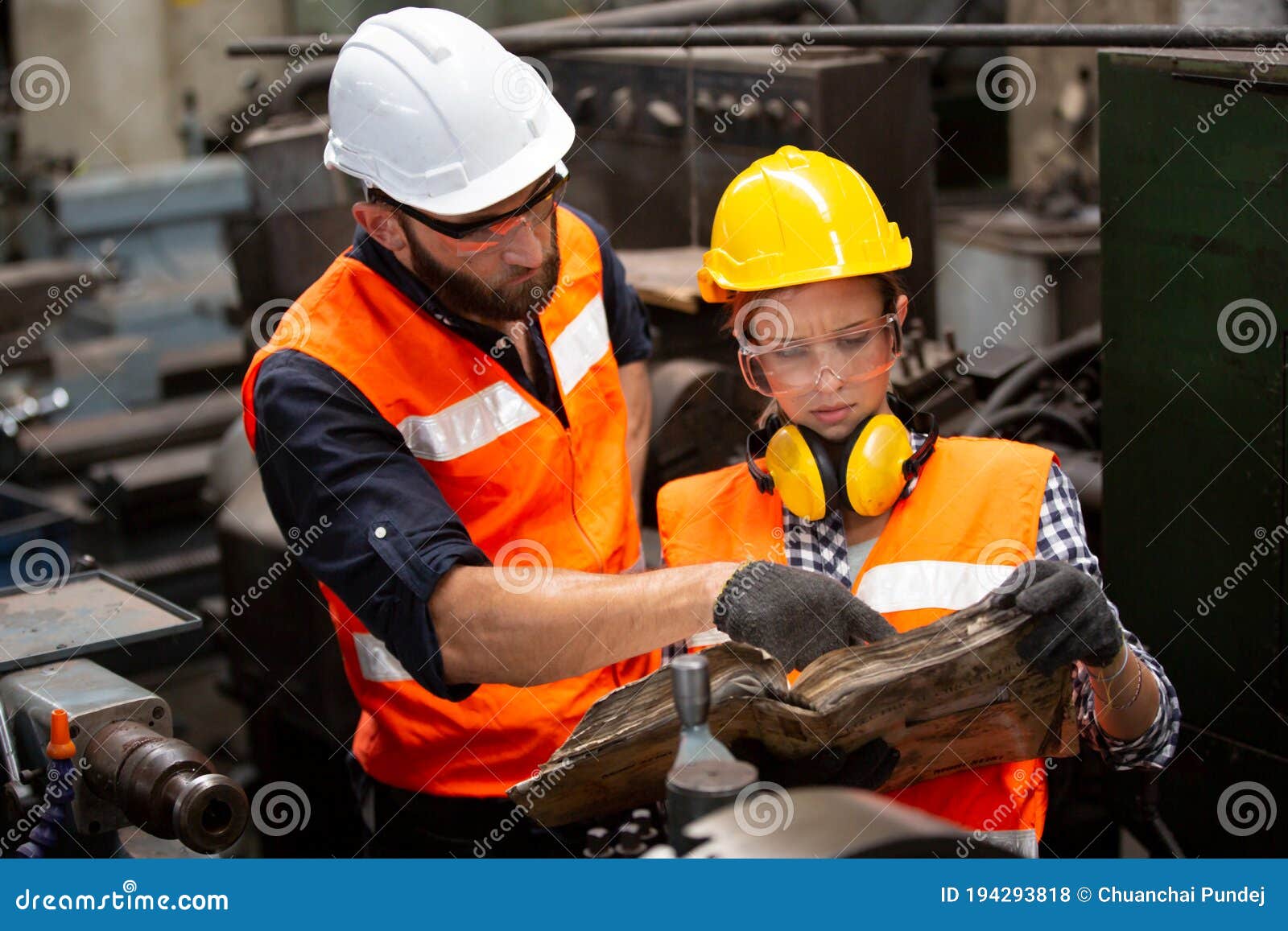 Wo Engineers Reading on Manual of Operating Cnc Machine in Factory ...