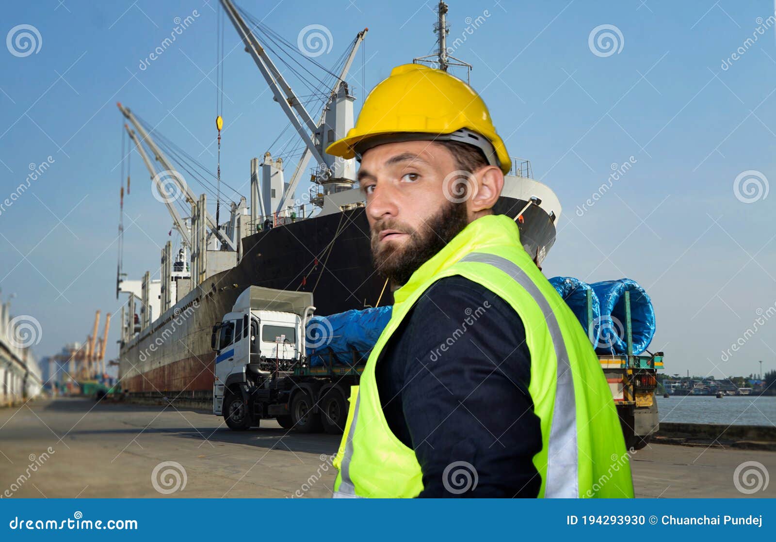 Engineer Standing Against Container Ship and Truck at Over Seaport ...