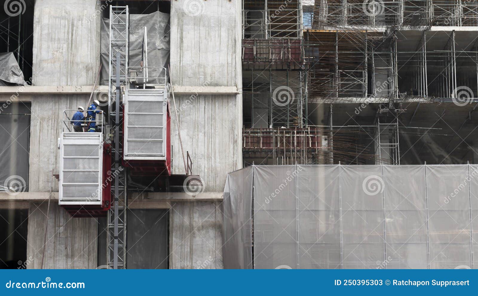 Engineers Repairing Elevators at Construction Site Stock Image - Image ...