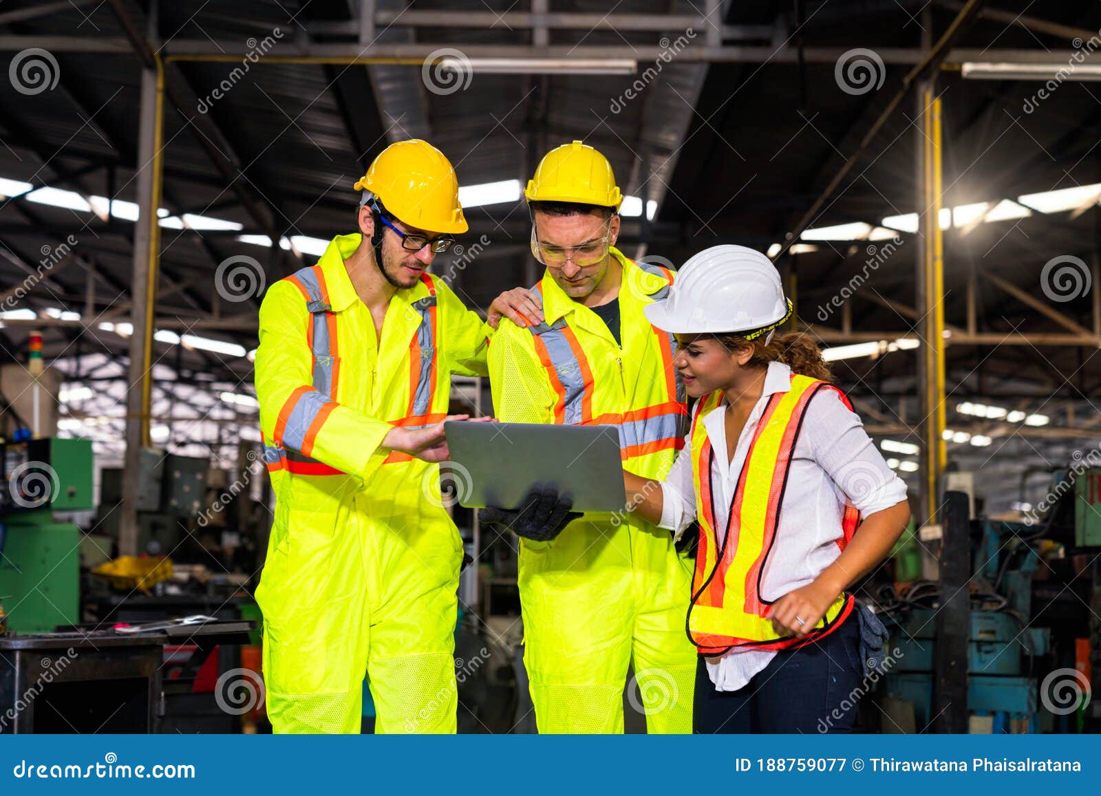 Engineers and Skilled Technicians are Holding Laptops and Working in ...