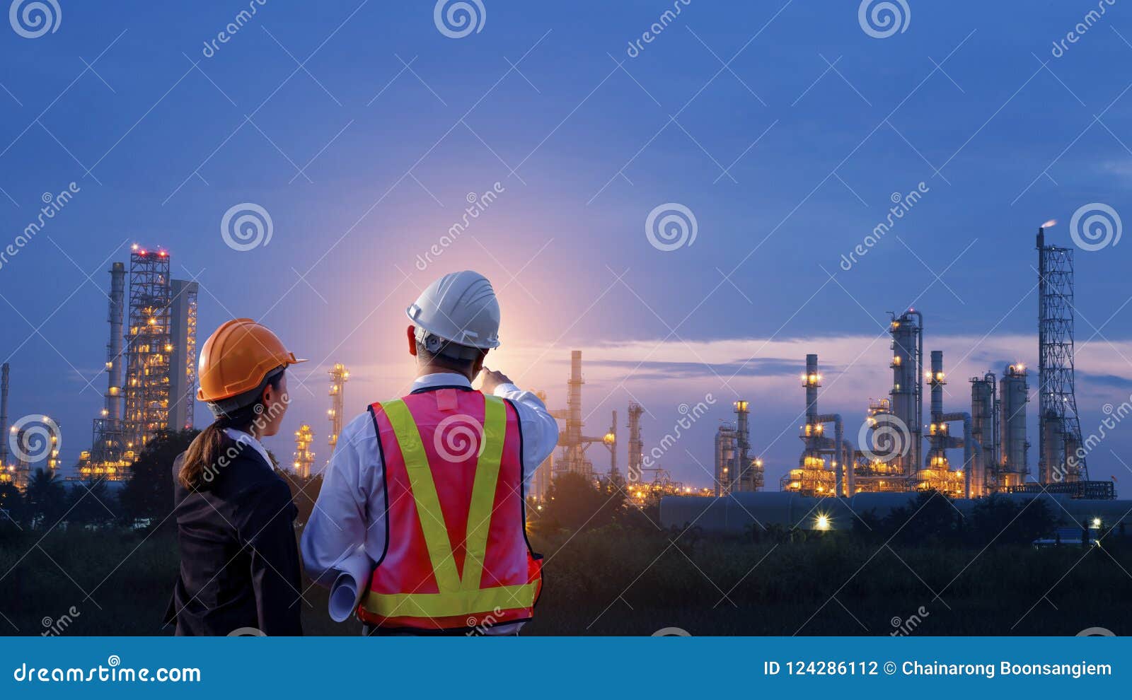 The Engineers are Standing on Large Industry Background. Stock Photo ...
