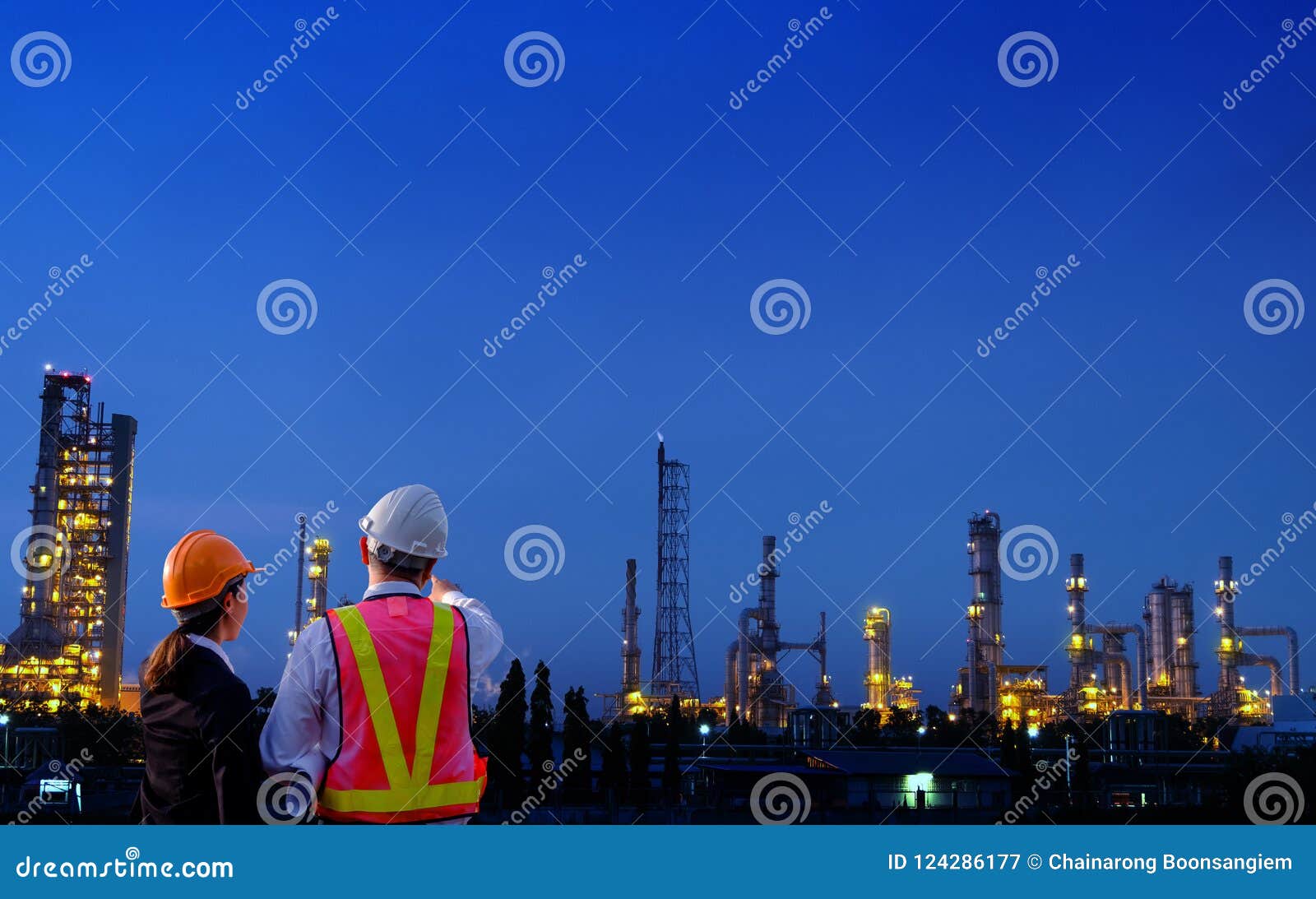 The Engineers are Standing on Large Industry Background. Stock Image ...