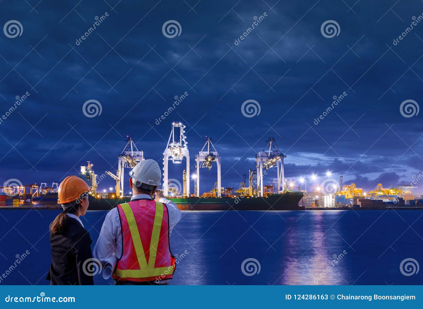 The Engineers are Standing on Large Industry Background. Stock Image ...