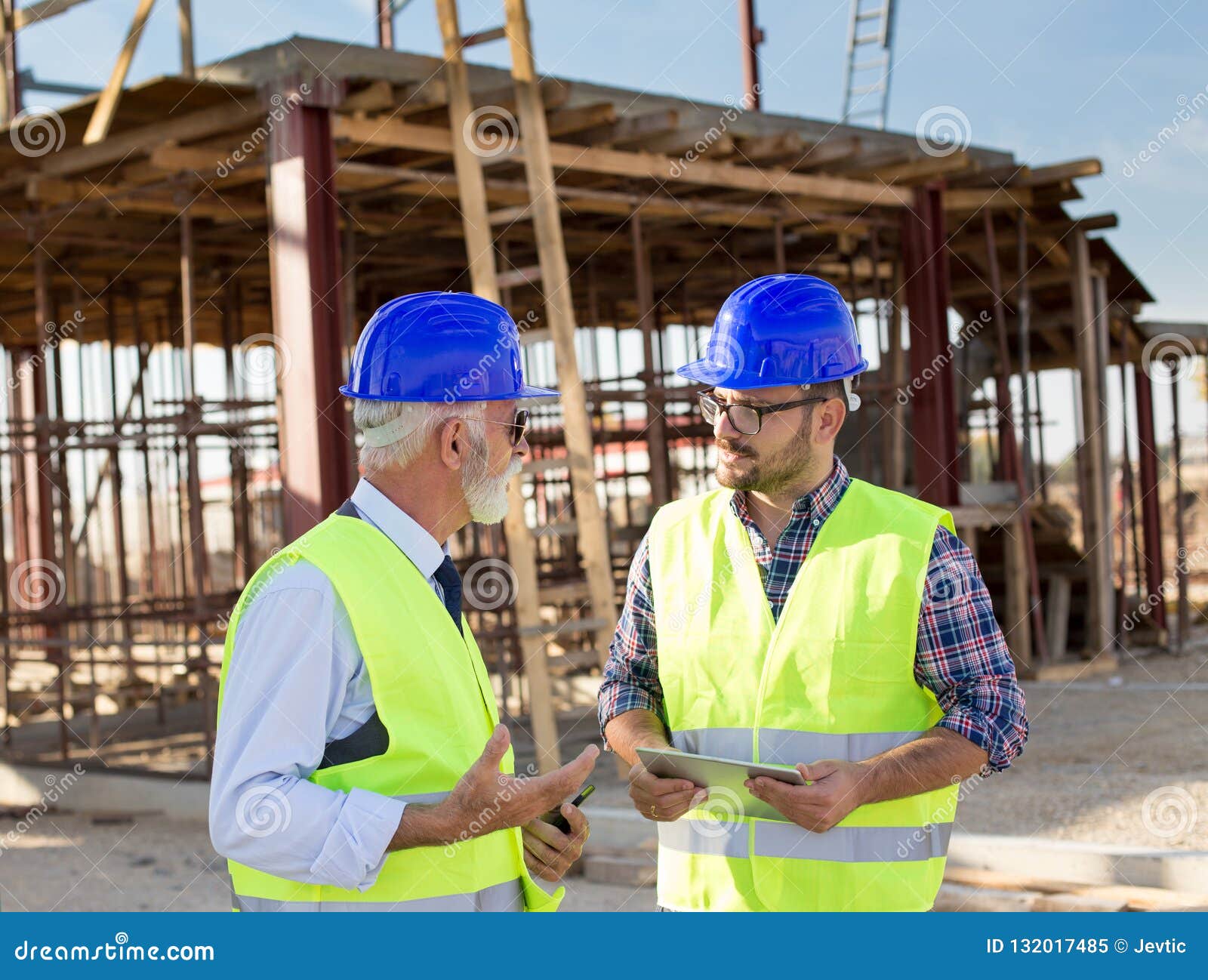Engineers Talking at Building Site Stock Image - Image of construction ...