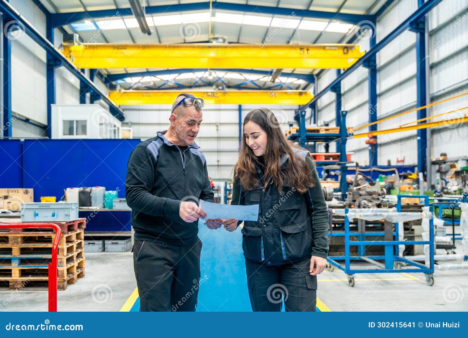Engineers Talking while Working in a Cnc Logistics Factory Stock Image ...