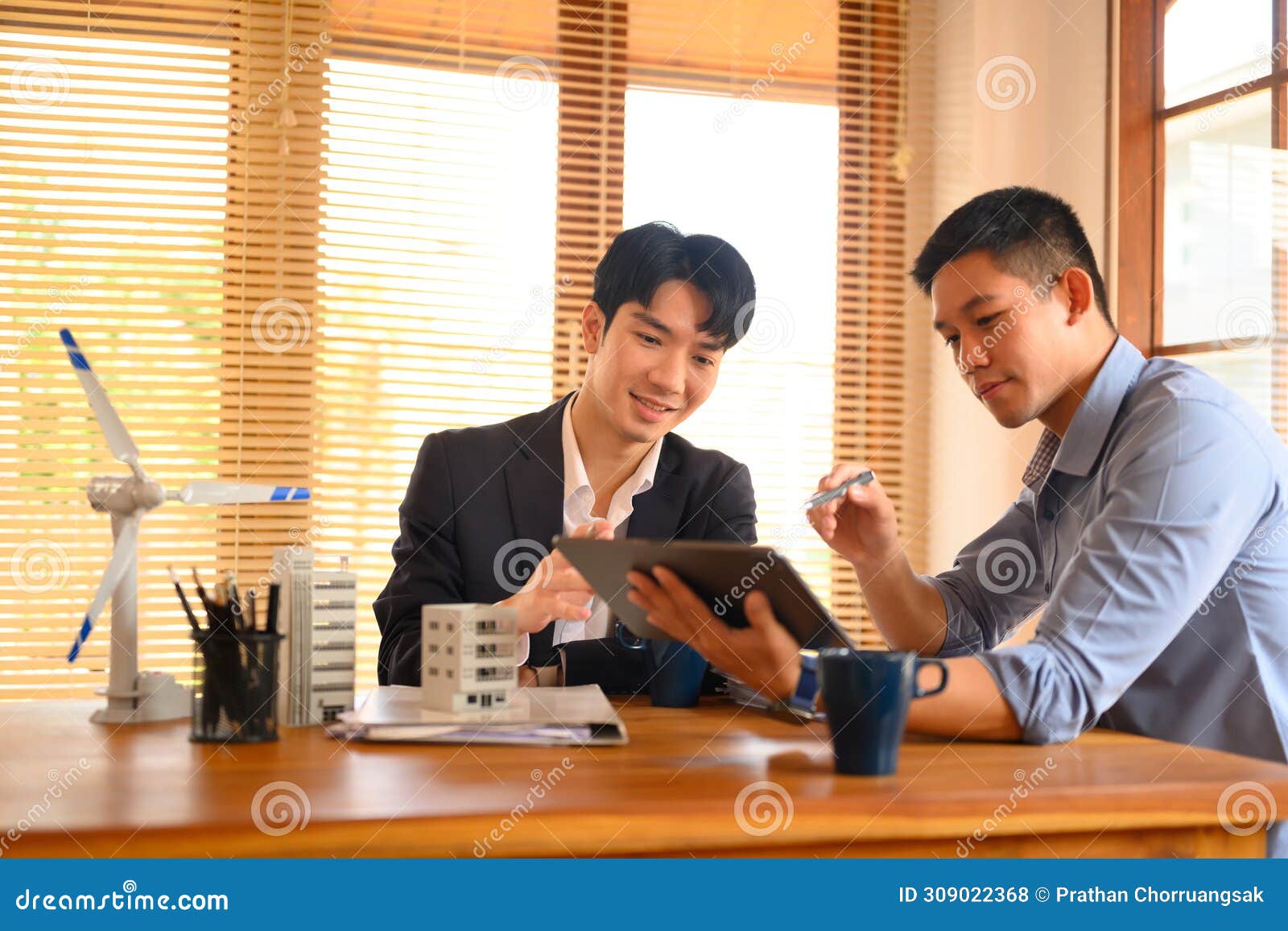 Engineers Team Having a Discussion while Working a Renewable Energy ...