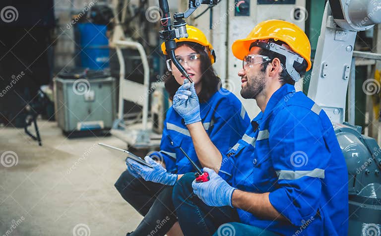 Engineers Team Mechanic Using Computer Controller Robotic Arm for ...