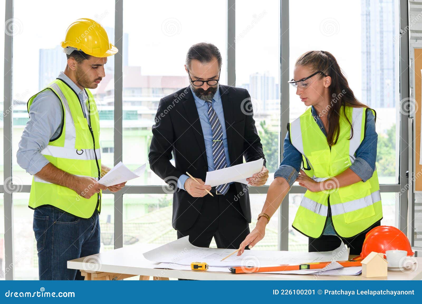 Engineers Team Meeting For Architectural Project. Architects Discussing ... Engineers Team Meeting For Architectural Project. Architects Discussing ...