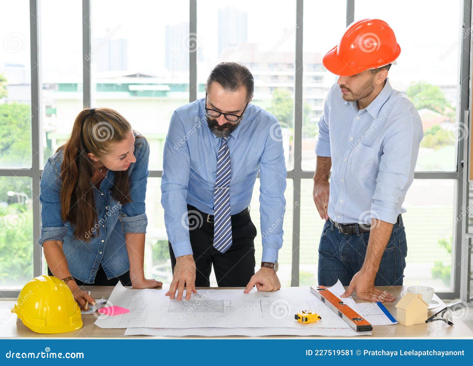 Engineers Team Meeting For Architectural Project. Architects Discussing ... Engineers Team Meeting For Architectural Project. Architects Discussing ...