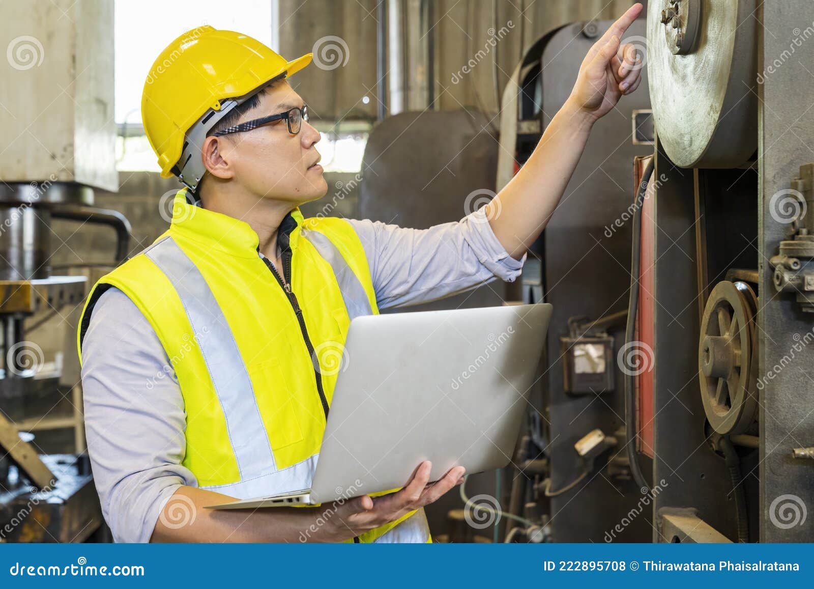 Engineers and Technicians are Carrying Laptops in an Industrial Factory ...