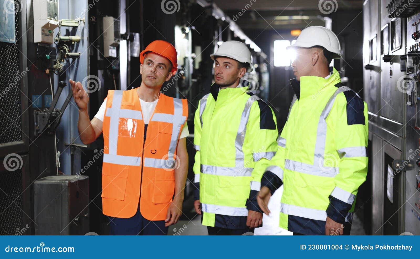 Engineers in Uniform and Helmets Do Pre-commissioning Works Inspecting ...