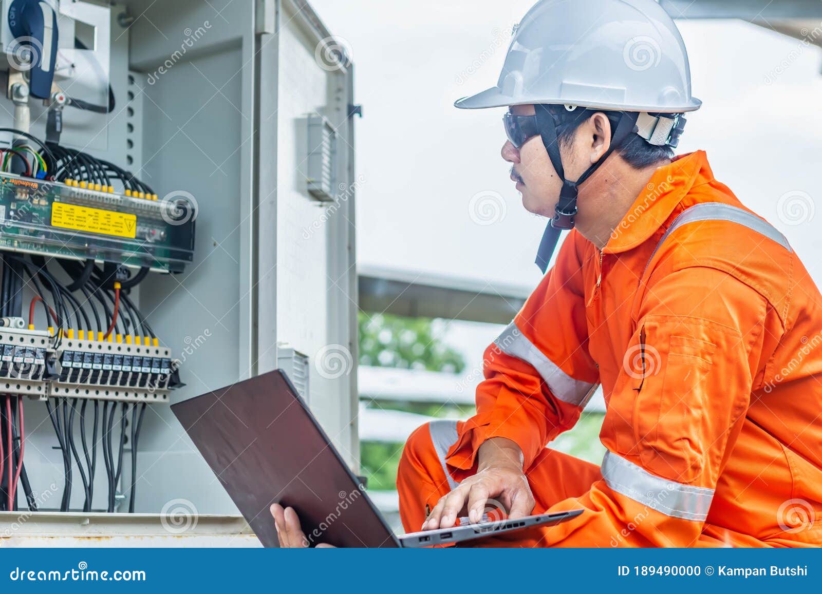 Engineers Upload Data of Power Energy To a Laptop for Checking the ...