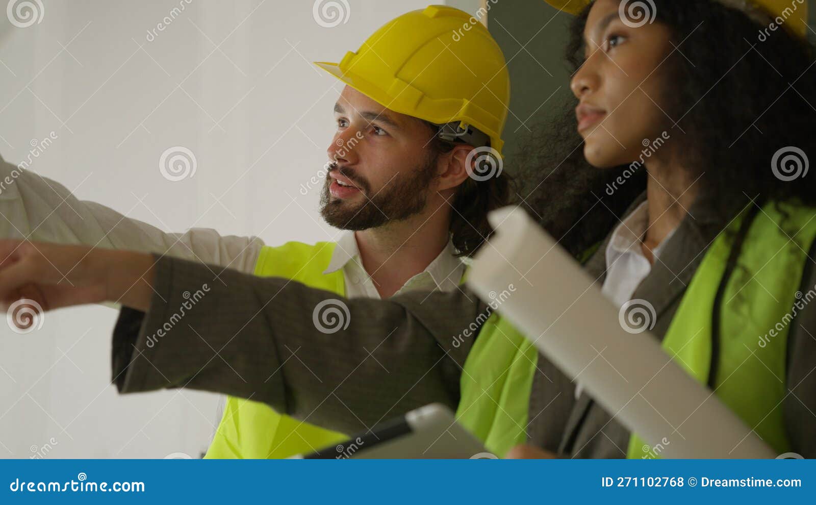 Engineers Using Tablet Talking and Brainstorming Together on ...