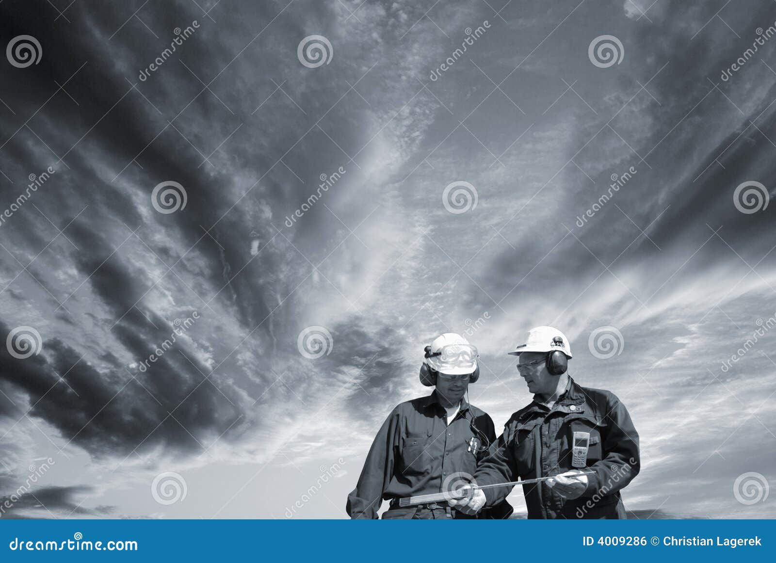 Engineers Walking Under Dark Clouds Stock Photo - Image of clouds ...