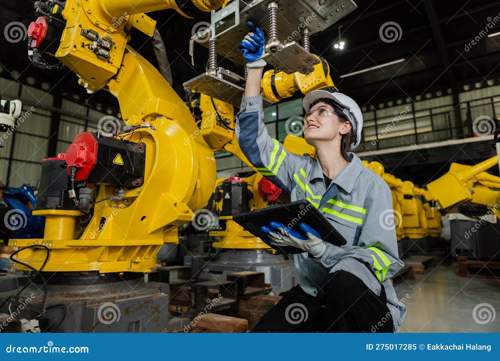 Engineers Woman Use Tablet To Check Condition Robotic Arm. Female ... Engineers Woman Use Tablet To Check Condition Robotic Arm. Female ...