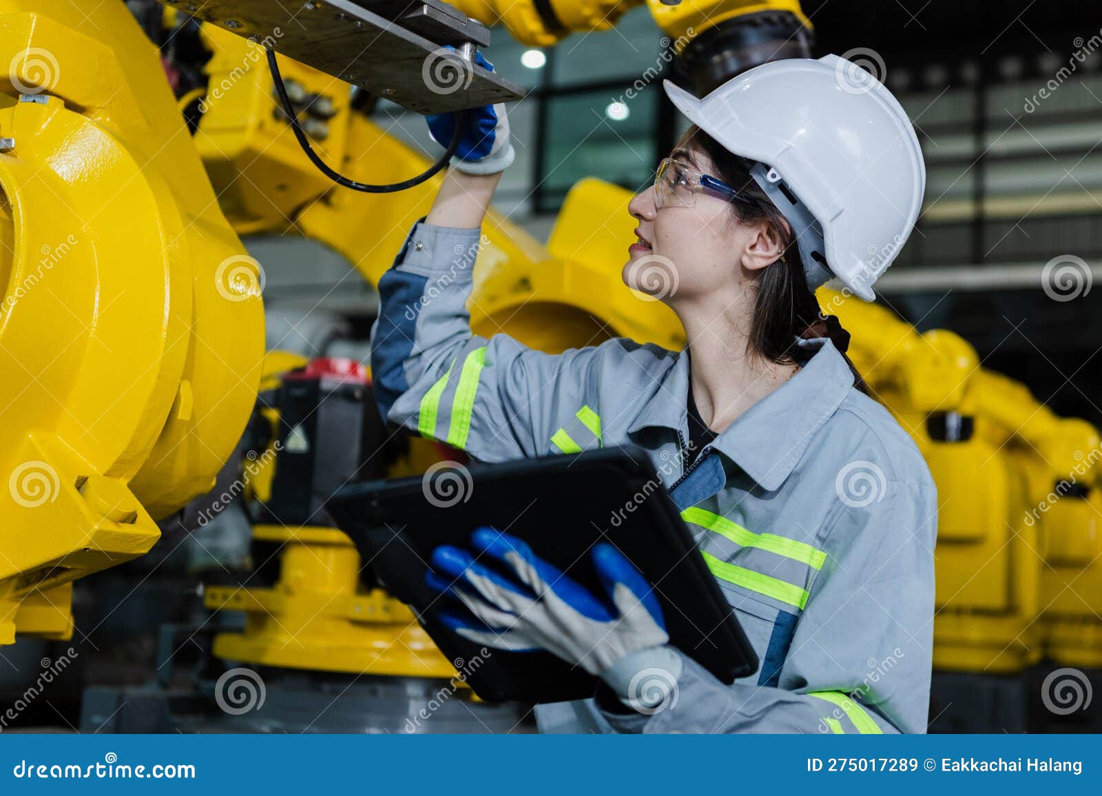 Engineers Woman Use Tablet To Check Condition Robotic Arm. Female ... Engineers Woman Use Tablet To Check Condition Robotic Arm. Female ...
