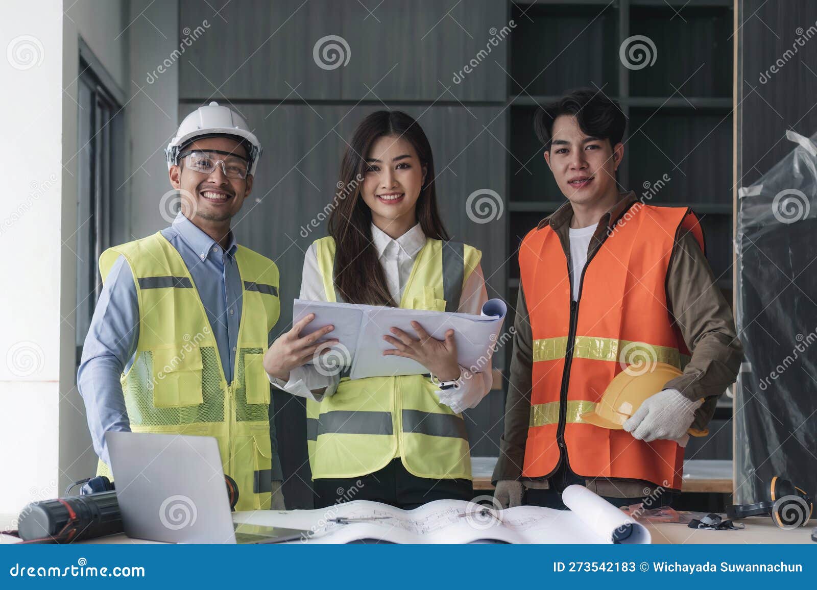 Engineers Work As a Team with Blueprints for Architectural Plans ...