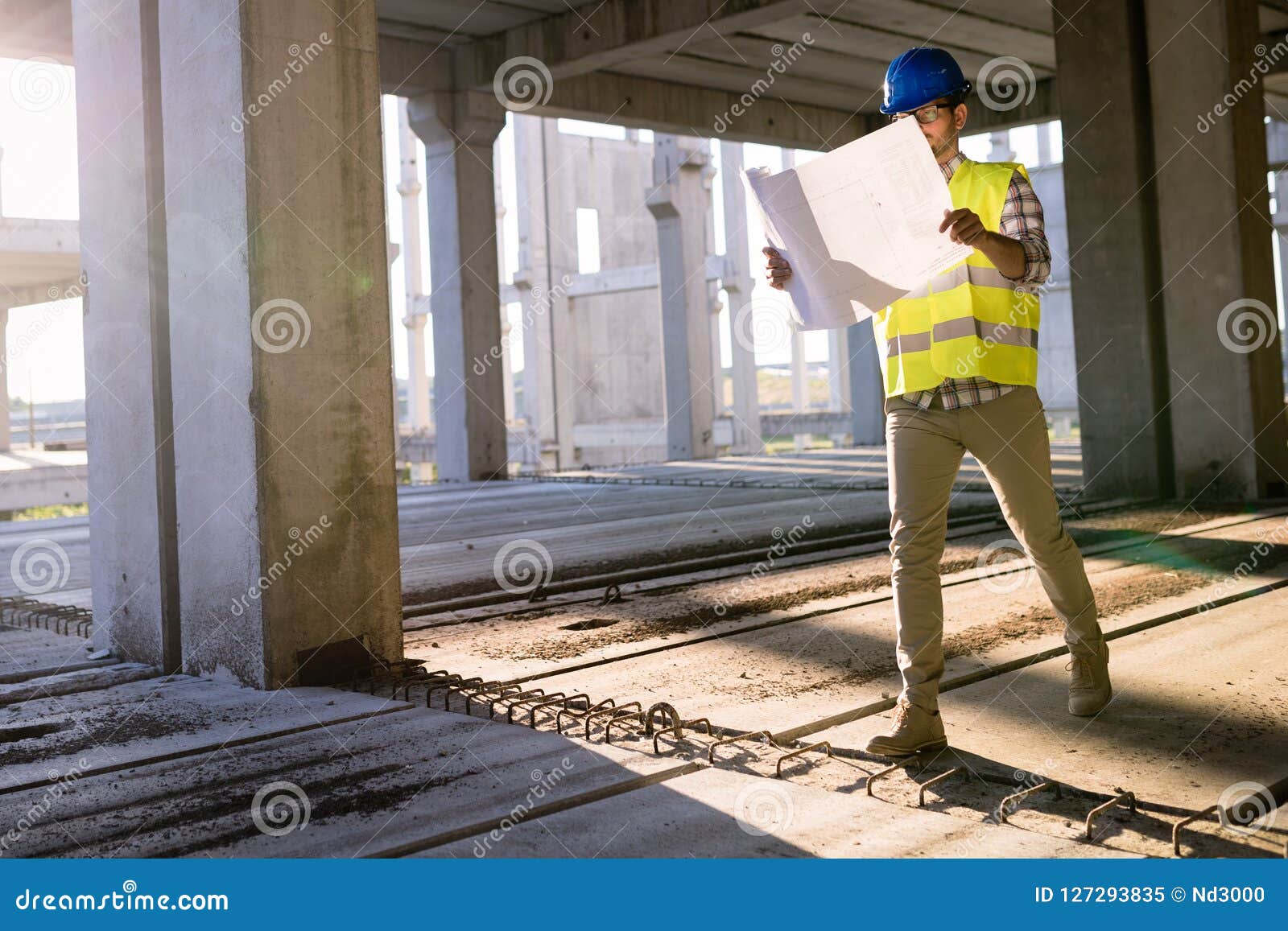Engineers Working on a Building Site with Blue Prints Stock Image ...