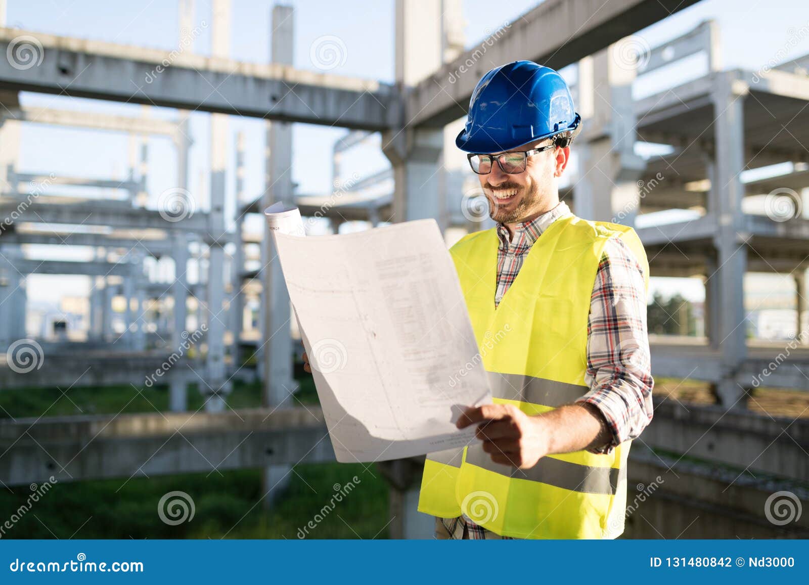 Engineers Working on a Building Site with Blue Prints Stock Photo ... Engineers Working on a Building Site with Blue Prints Stock Photo ...