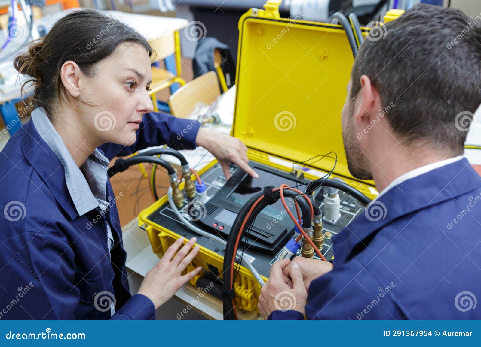 Engineers Working with Portable Electronic Device Stock Photo - Image ...