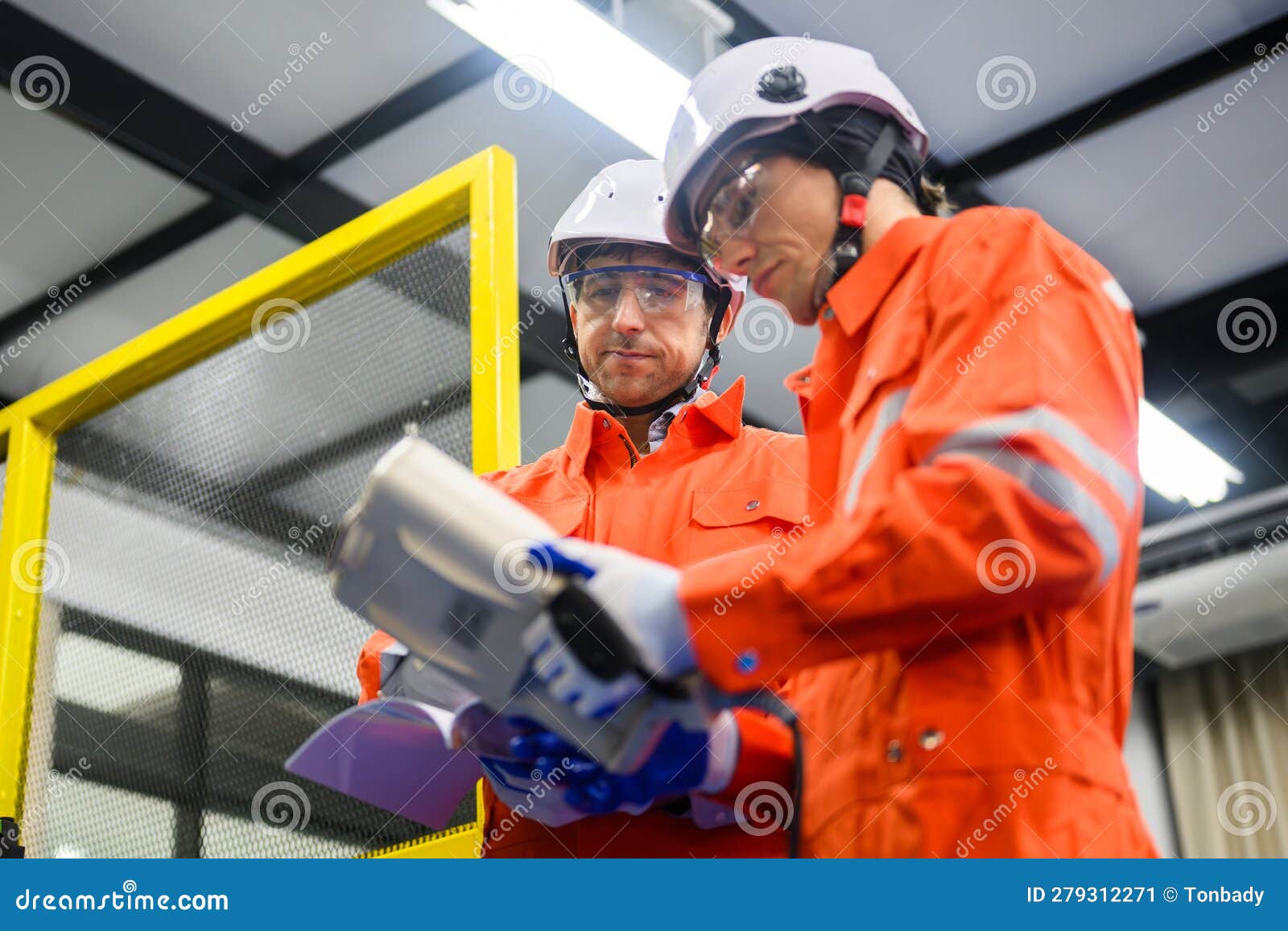 Engineers Working and Solving Problems on Machine at Industrial Plant ...