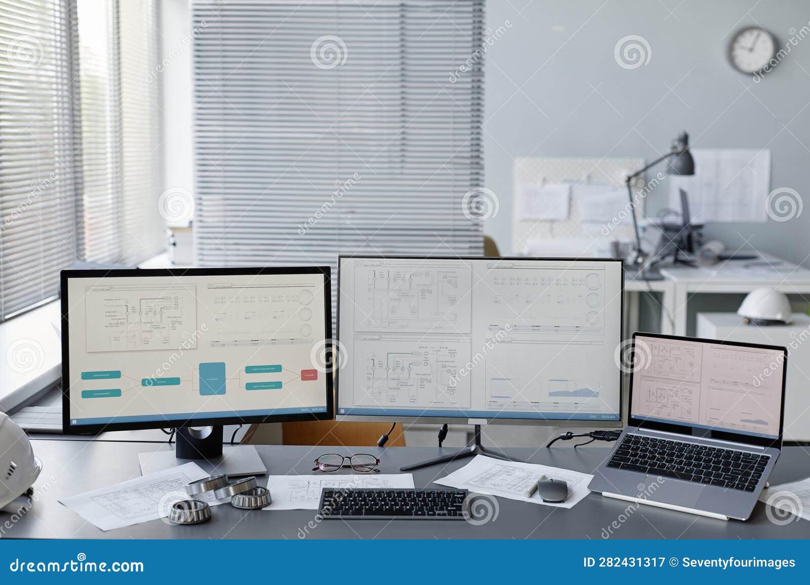 Engineers Workplace in Office with Blueprints on Multiple Computer ...