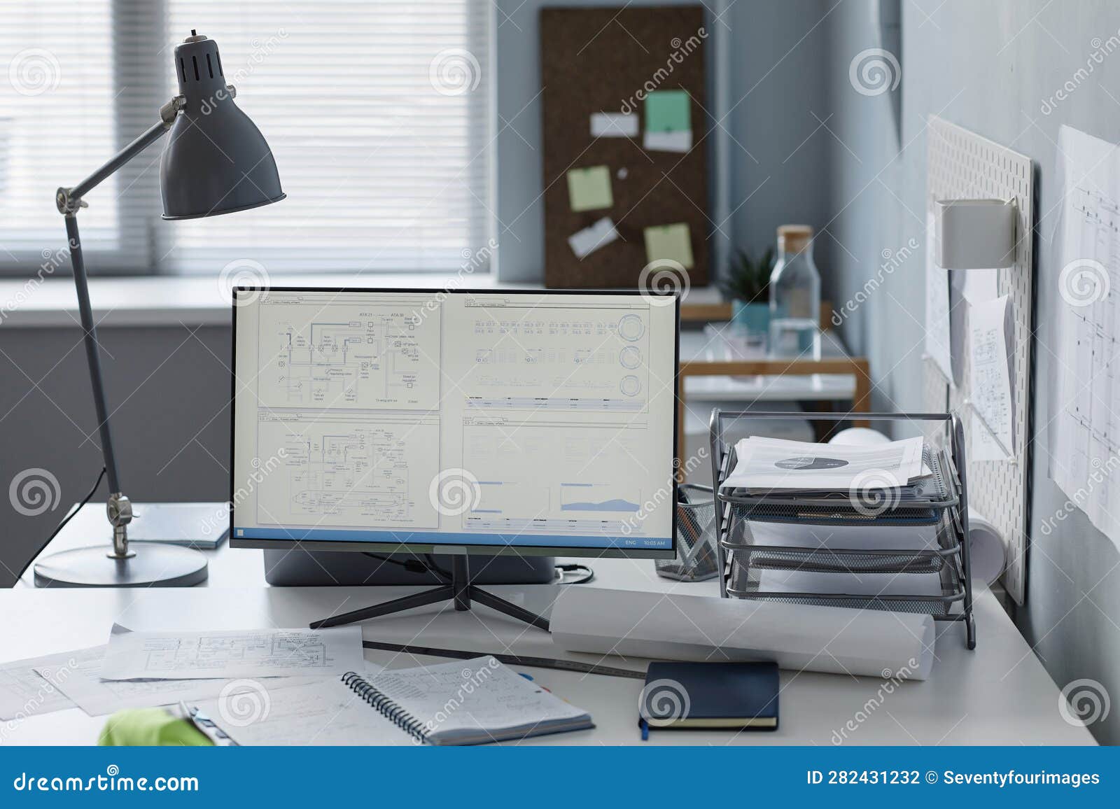 Engineers Workplace in Office with Plans on Computer Screen Stock Photo ...