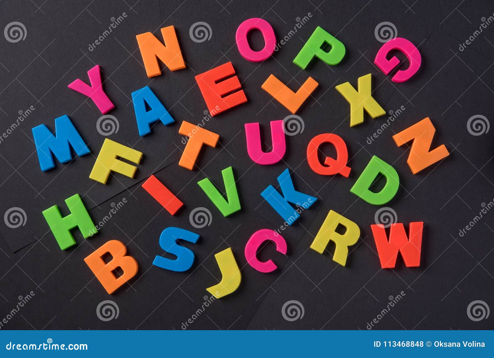 English Alphabet of Letters of Different Colors on a Black Background ...