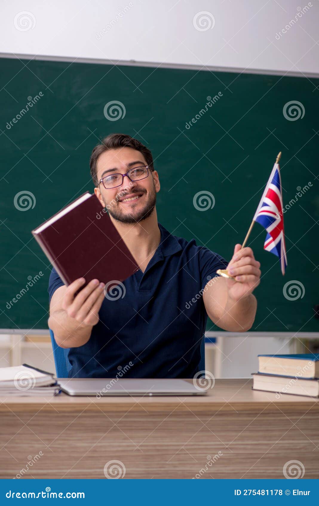 Male English Language Teacher in Front of Green Board Stock Photo ...