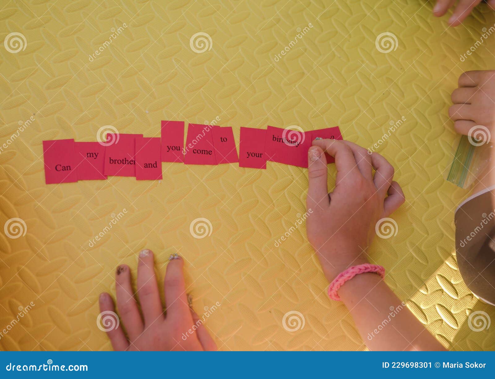 English Lesson. Children Assemble English Words into Sentences Stock ...