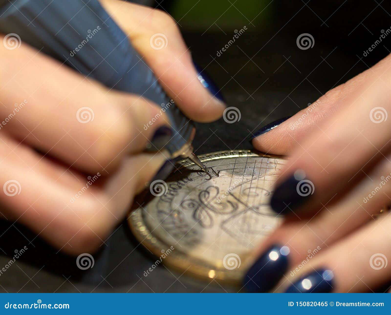 Woman engraver at work. stock image. Image of indoors - 150820465