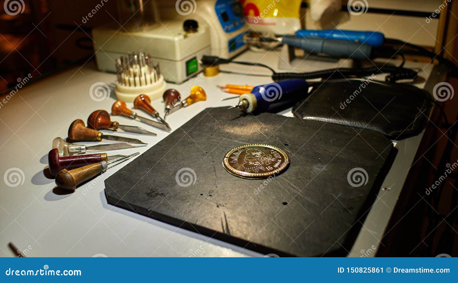 Woman engraver at work. stock image. Image of design - 150825861