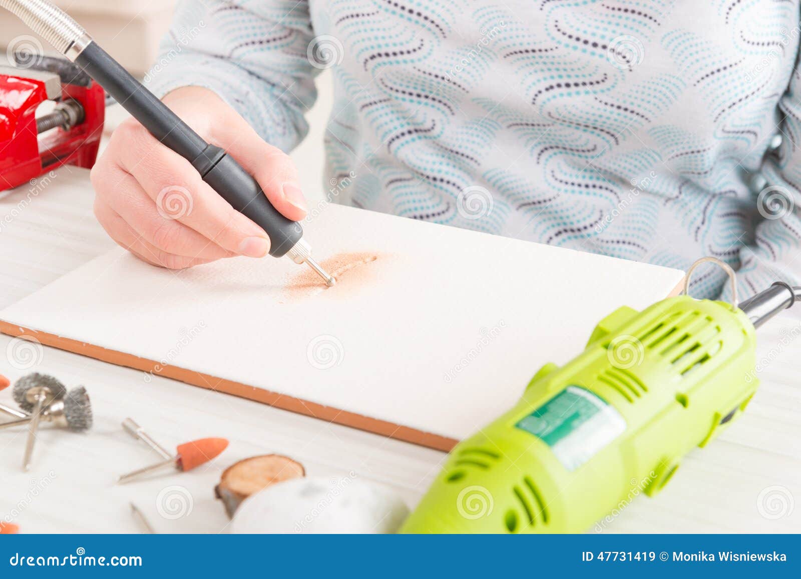 Engraving Tile with Rotary Multi Tool Stock Image - Image of hands ...