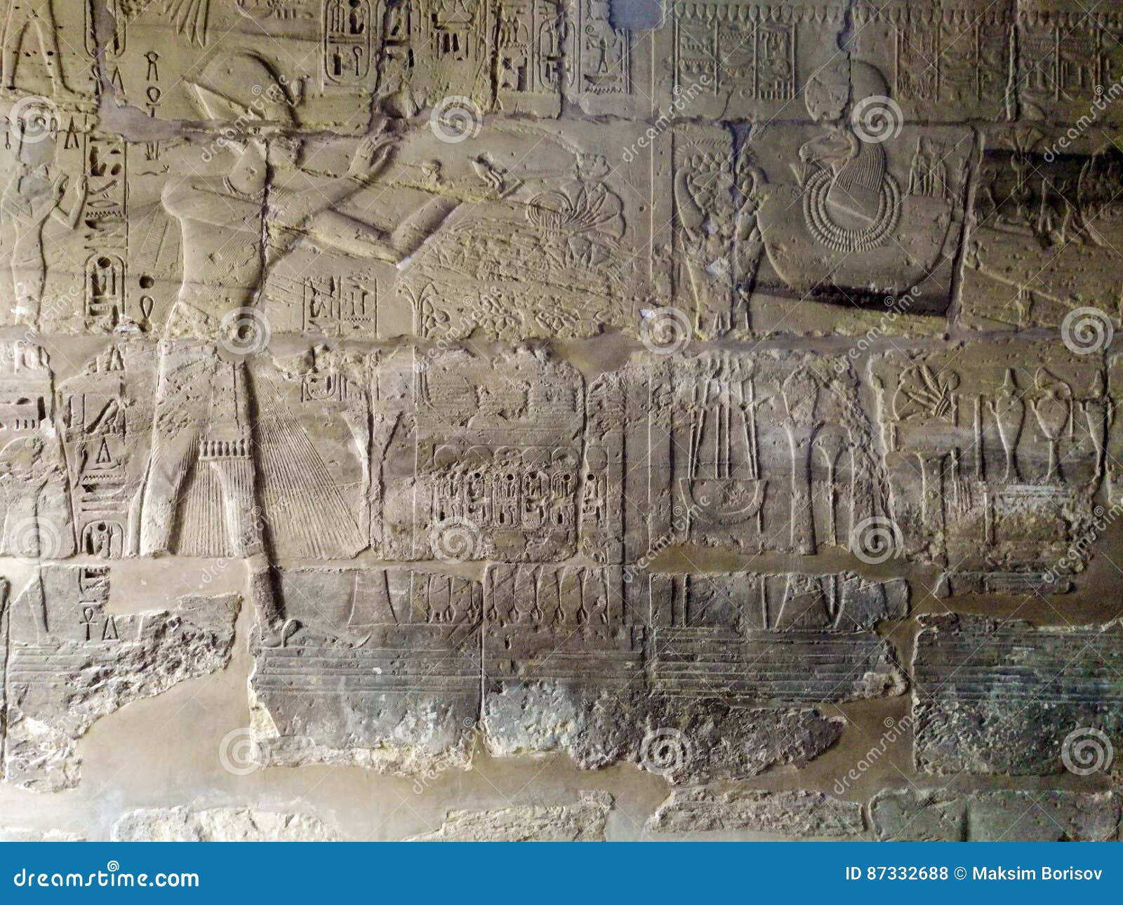 Engravings on the Wall of the Ancient Temple of Egypt. Stock Photo ...