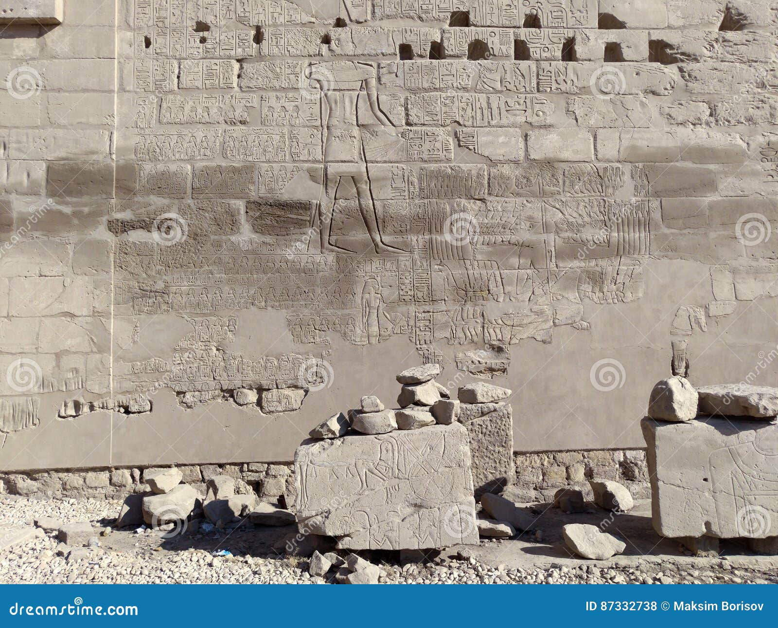 Engravings on the Wall of the Ancient Temple of Egypt. Stock Photo ...