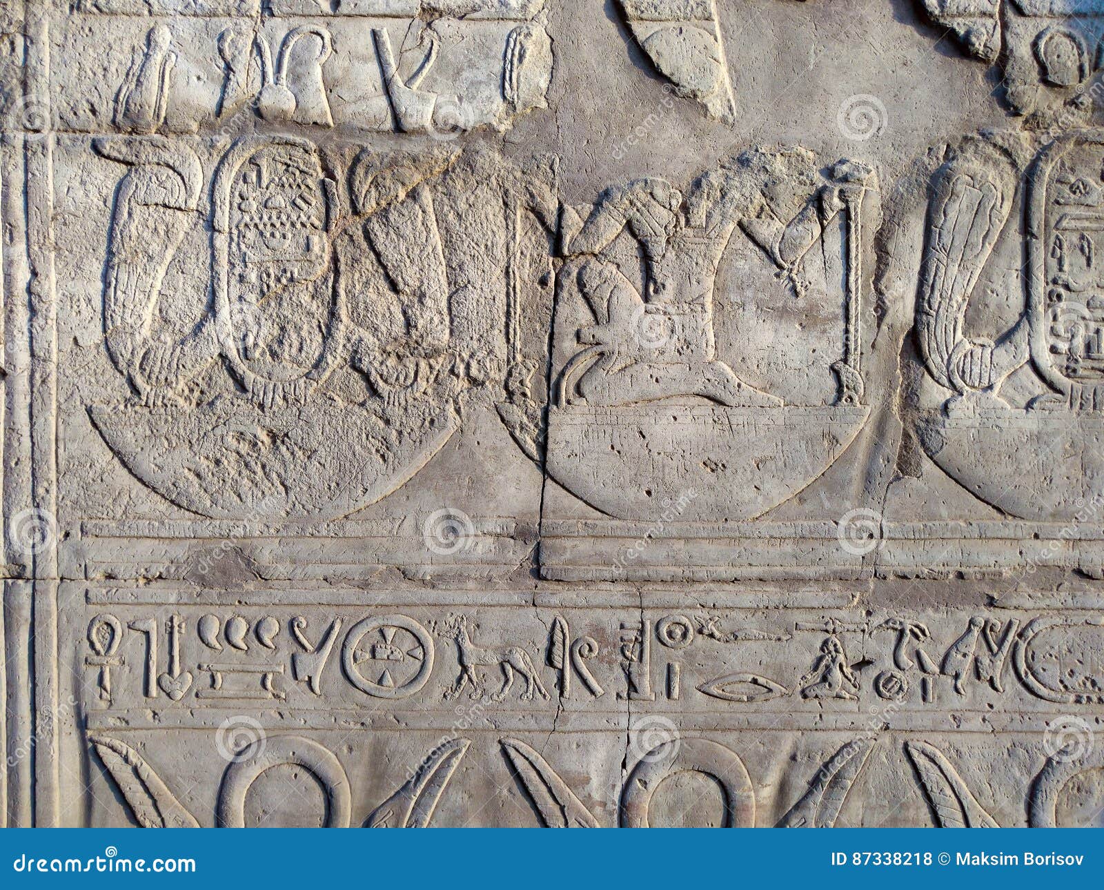 Engravings on the Wall of the Ancient Temple of Egypt. Stock Photo ...